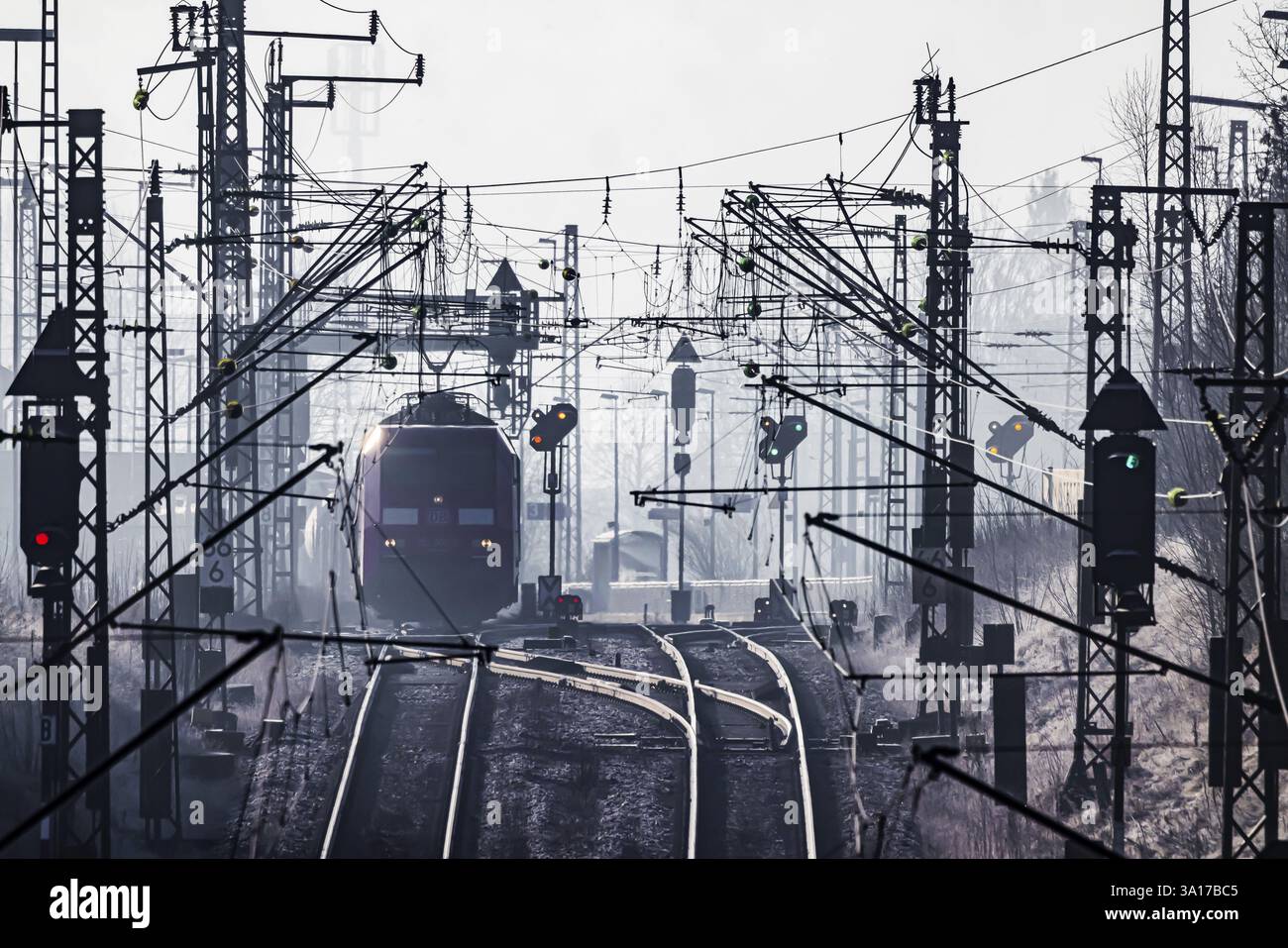 Deutsche Bahn AG tracks backlit with RegionalExpress. Overhead line ...