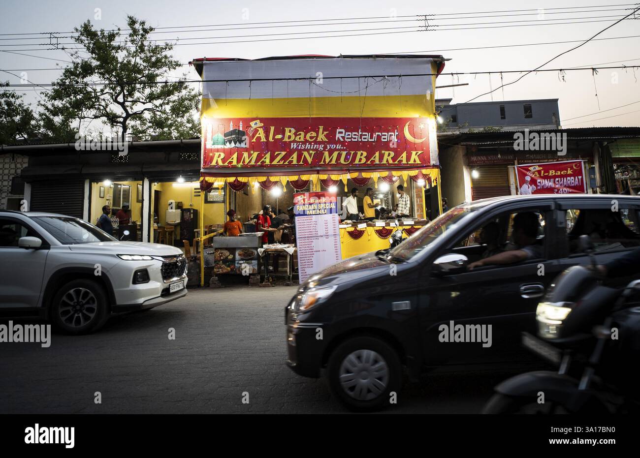 Muslims buy food at a stall to have Ramadan's Iftar during Muslim holy ...