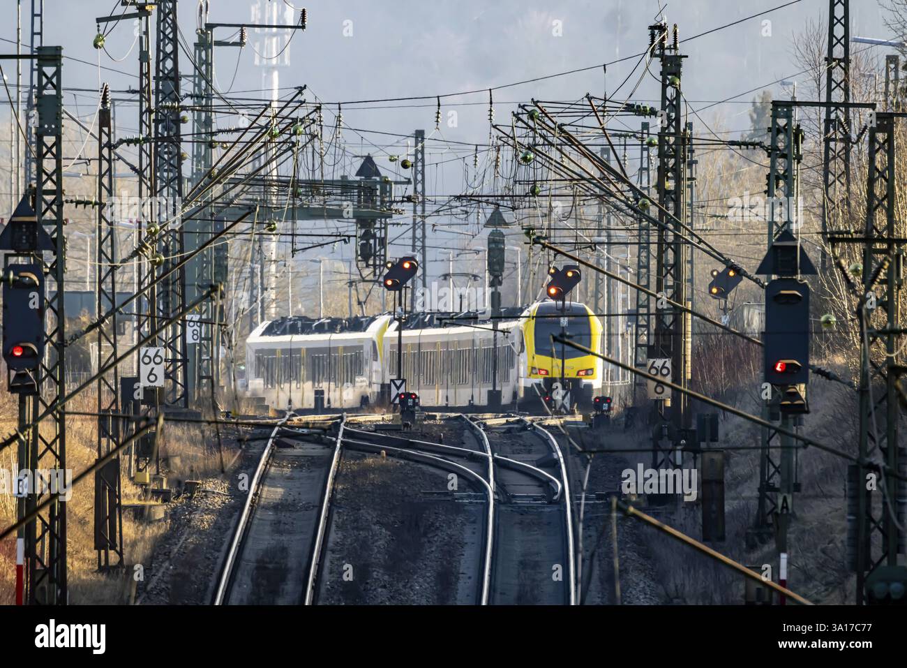 Deutsche Bahn AG tracks with regional train. Overhead line, signals and ...