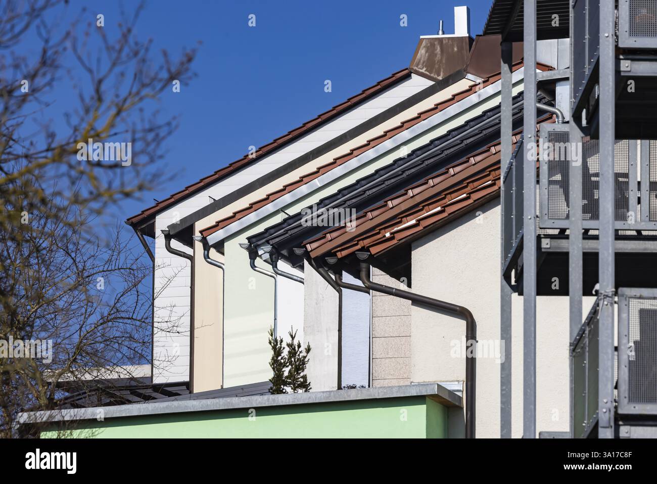 Terraced houses, architecture in series. Homes with pitched roofs and ...