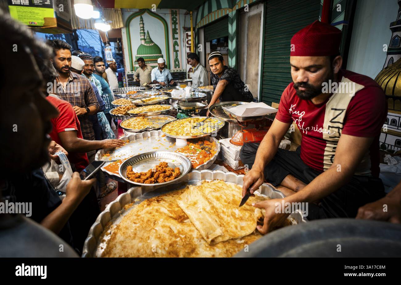 Muslims buy food at a stall to have Ramadan's Iftar during Muslim holy ...