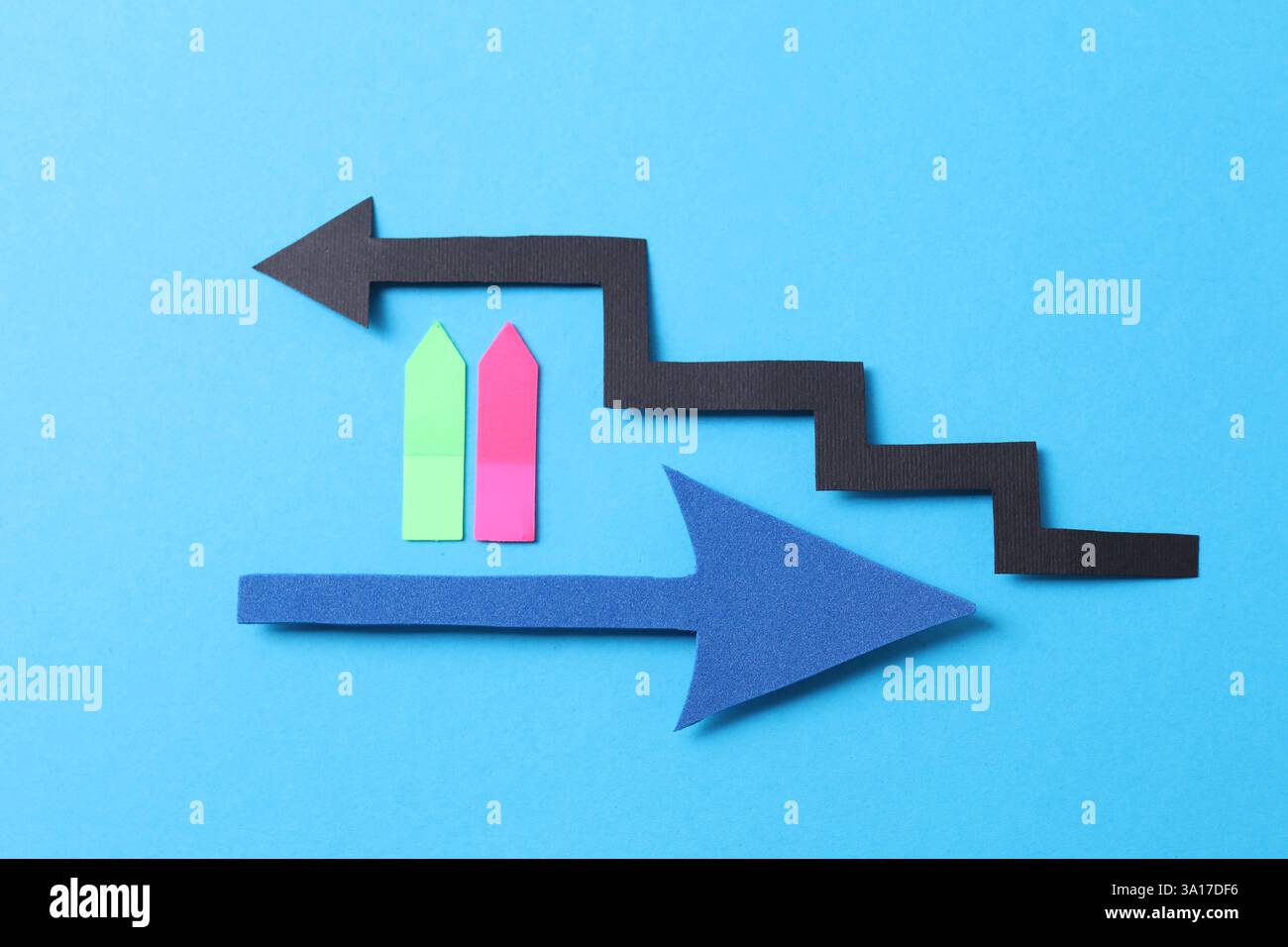 Different paper arrows on light blue background, flat lay Stock Photo ...