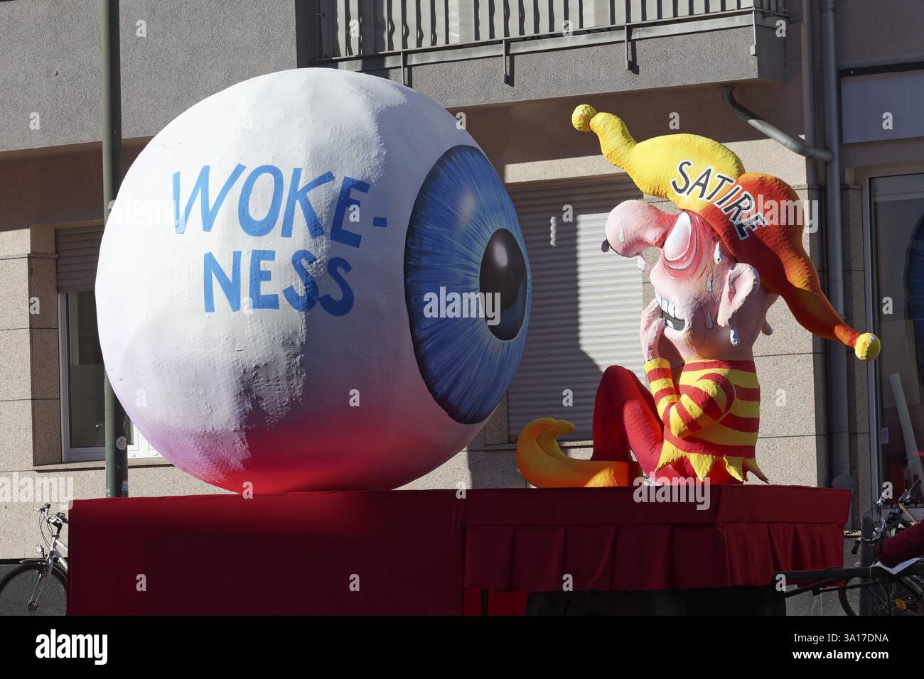 Wokeness eye looks at personified satire, figure is afraid of bans ...