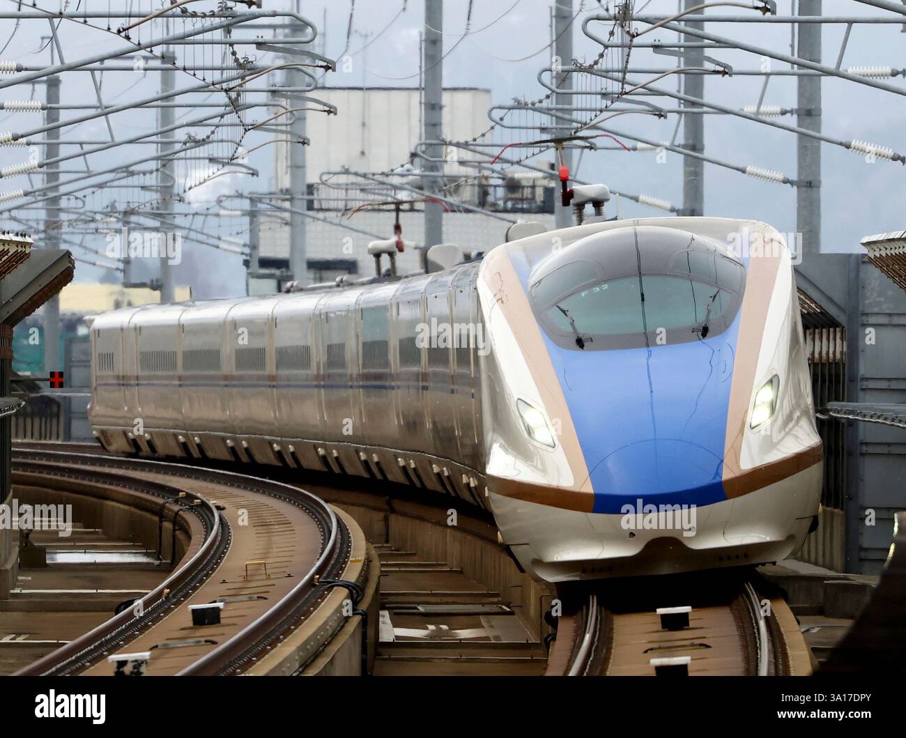 The photo shows Japan's Hokuriku Shinkansen (bullet train) on March 7 ...