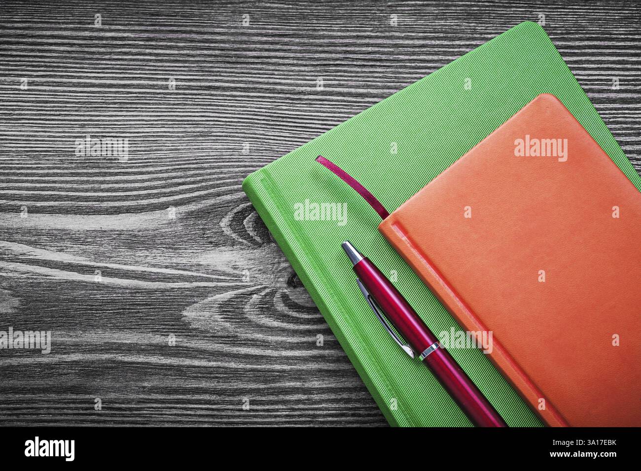 Diary books pen on vintage wood board office concept Stock Photo - Alamy