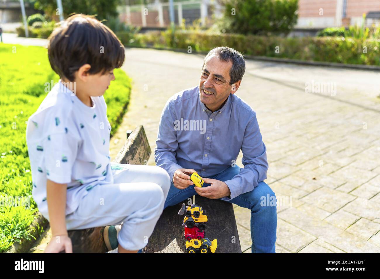 Grandfather and grandson enjoying quality time together, playing with ...