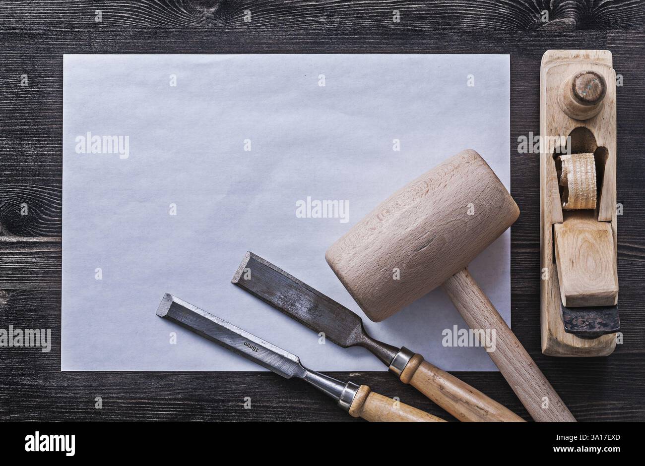 Flat chisels wooden hammer planer sheet of paper construction concept ...
