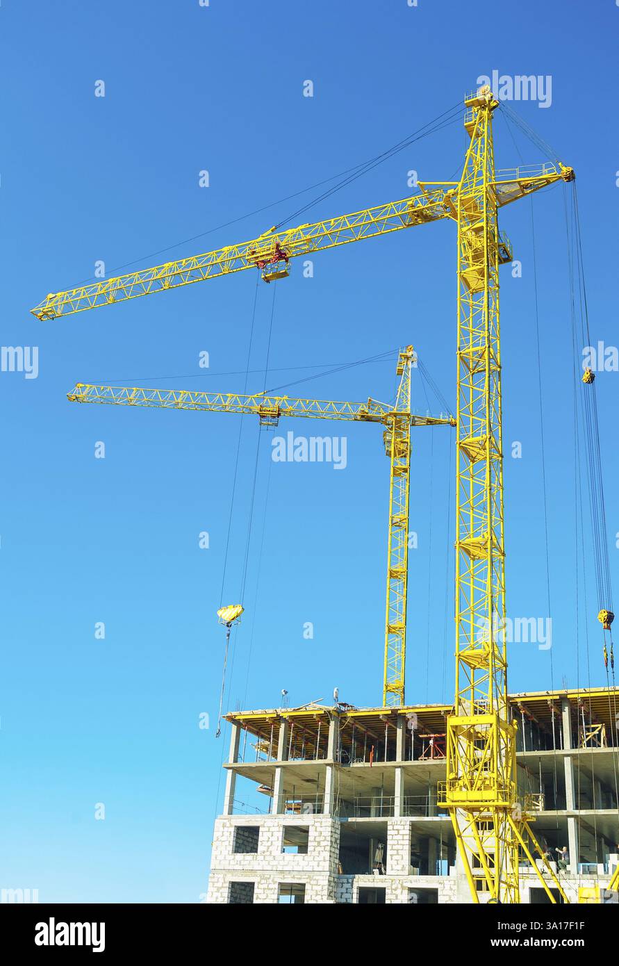 Construction cranes in work Stock Photo - Alamy