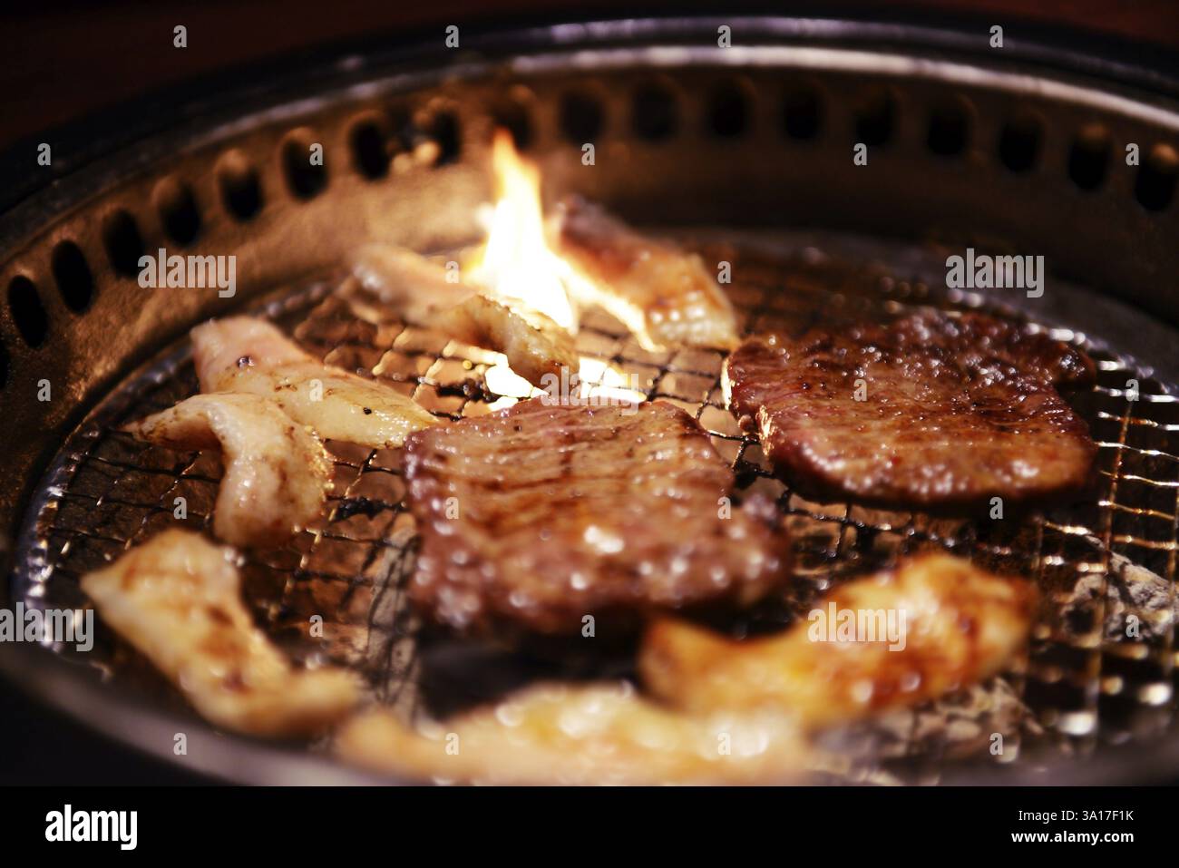 Meat being cooked at a Japanese grill restaurant. Yakiniku, Japanese ...