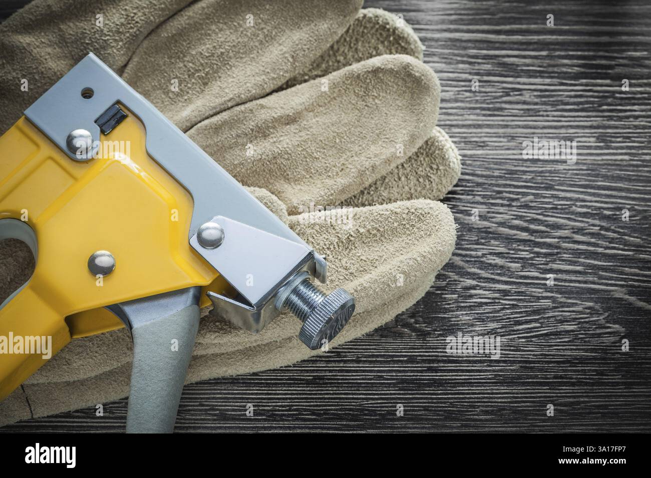Construction stapler pair of safety gloves Stock Photo - Alamy