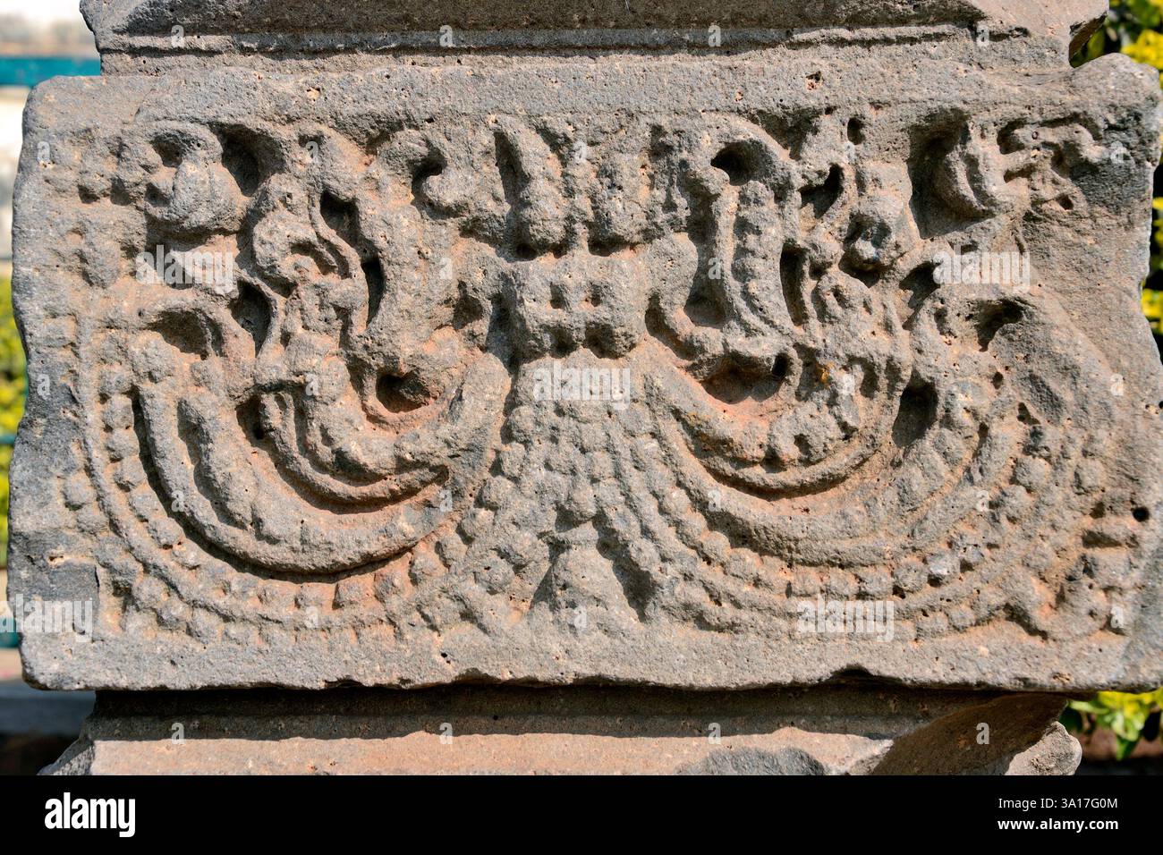 Carved stone artifacts displayed near the Solah Khamba Masjid, Fort ...