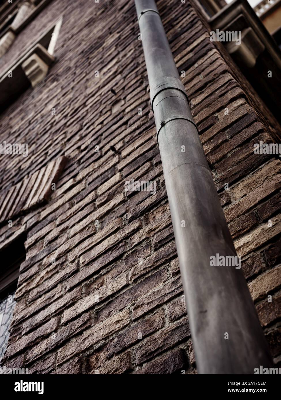 Closeup of a rustic copper downspout of old brick building Stock Photo ...