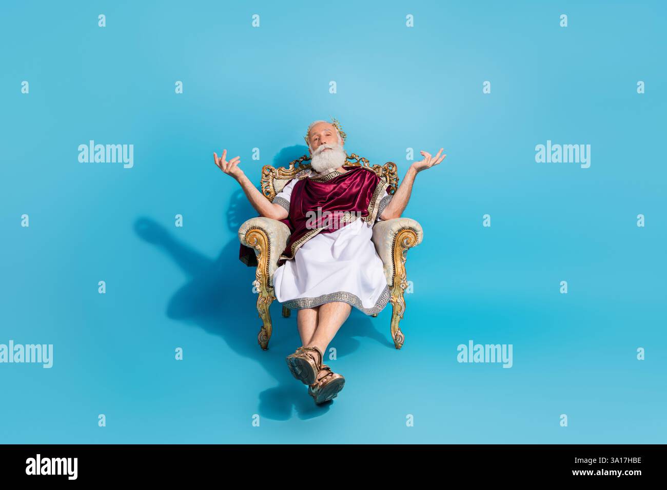 Full body portrait of theater actor ancient god costume sit throne ...