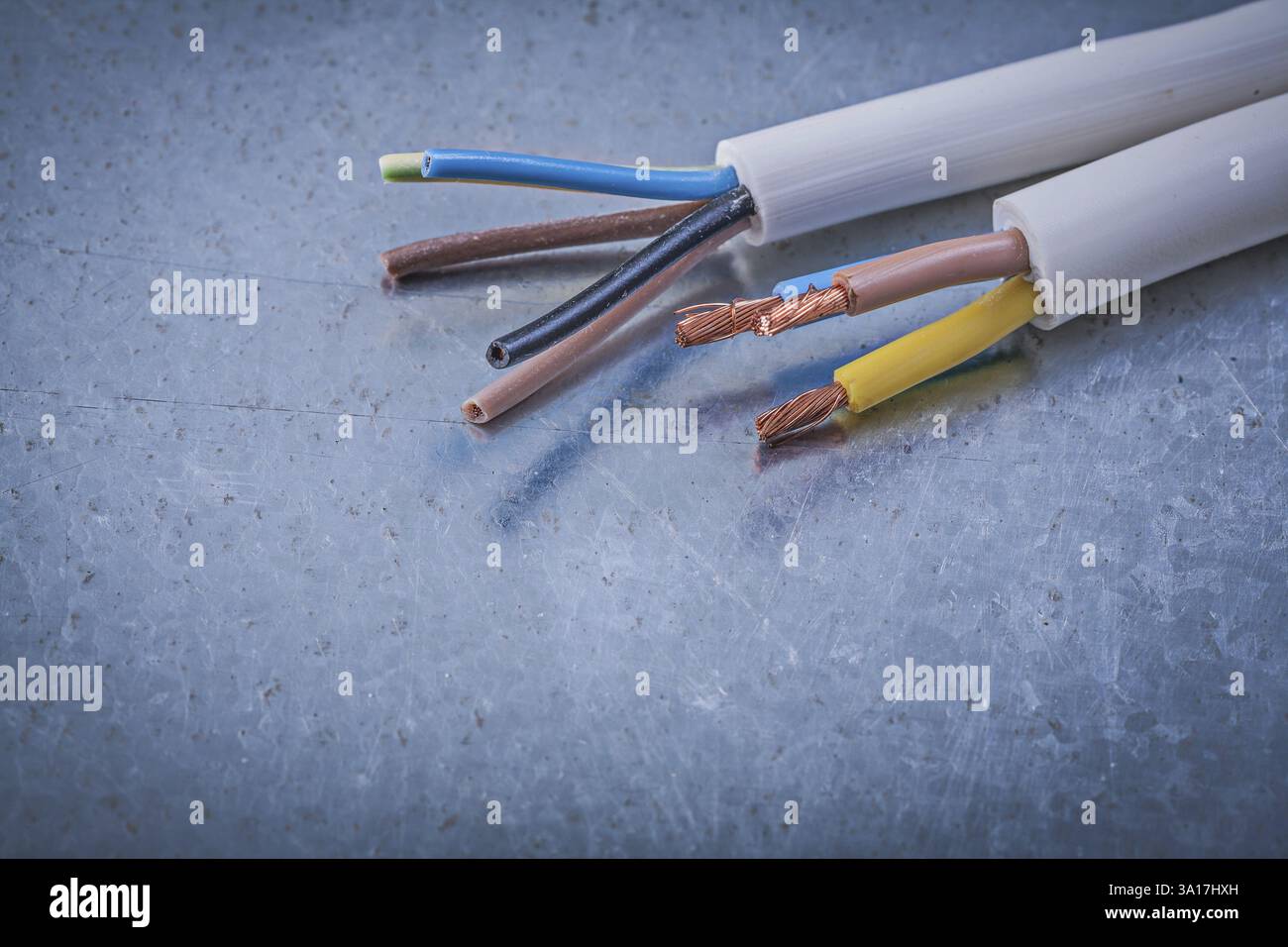 Electric cables wires on scratched metallic background construction ...