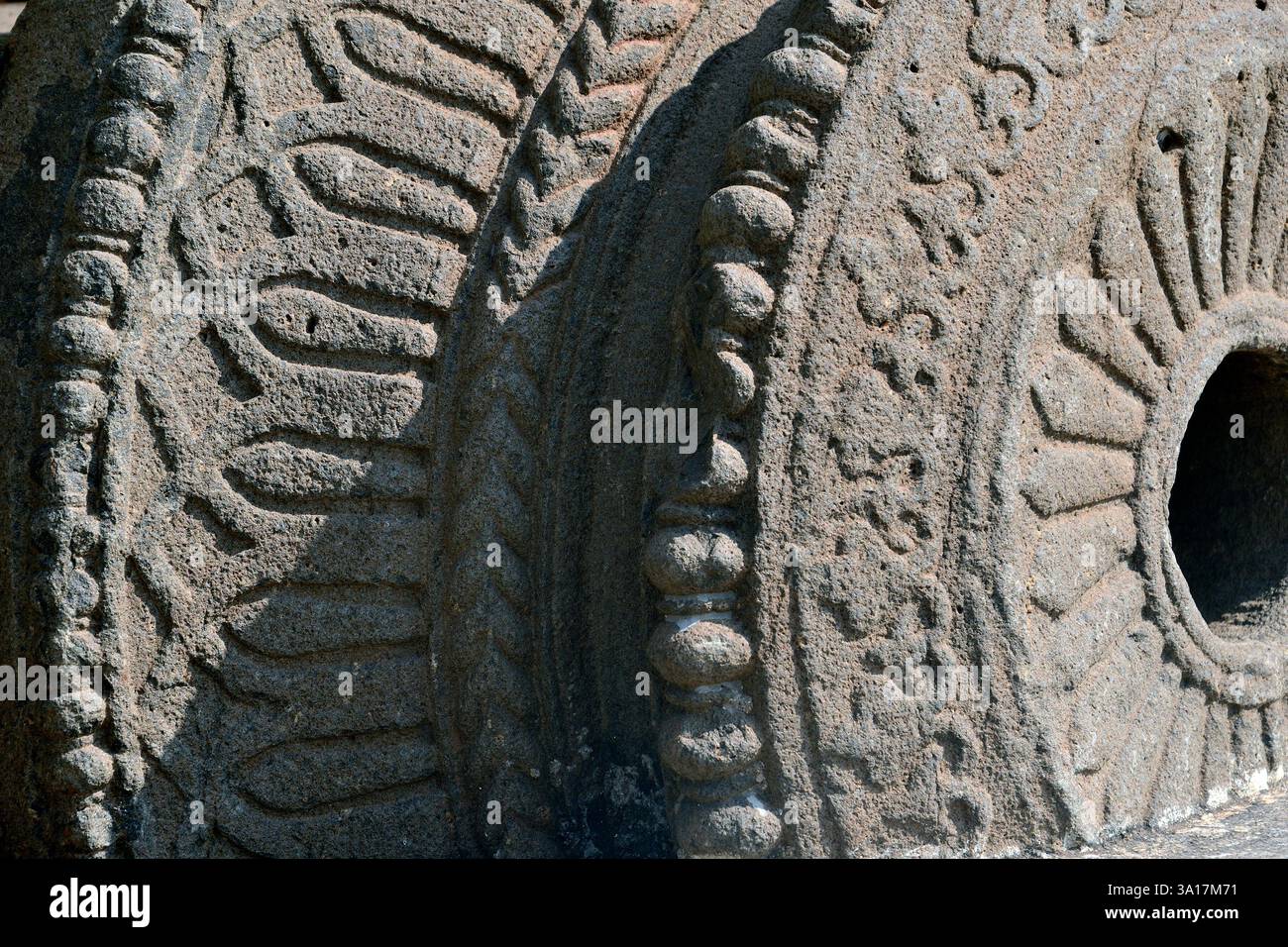 Carved stone artifacts displayed near the Solah Khamba Masjid, Fort ...