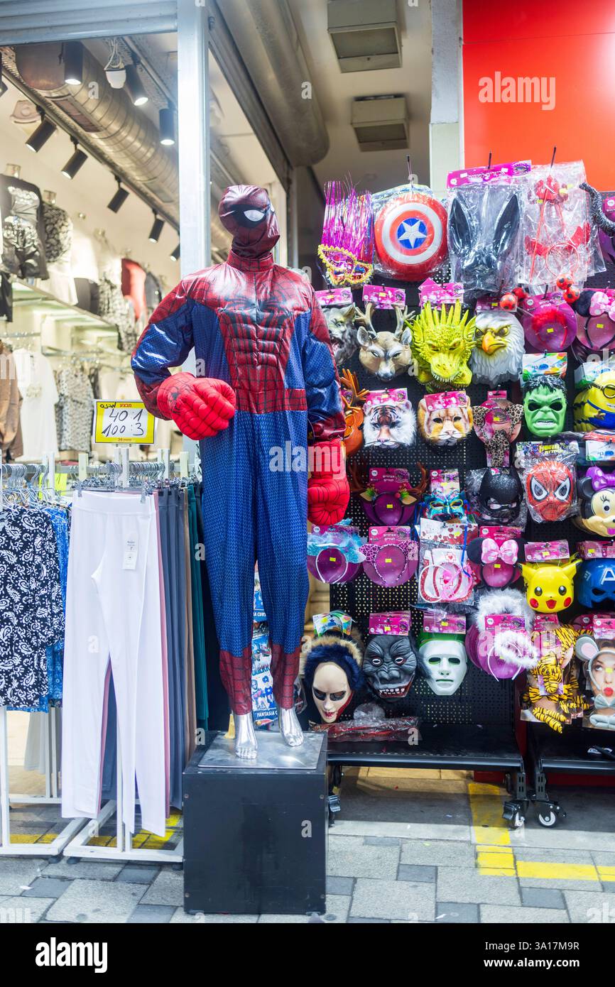 Haifa, Israel – March 7, 2025, A Batman costume and various masks for ...