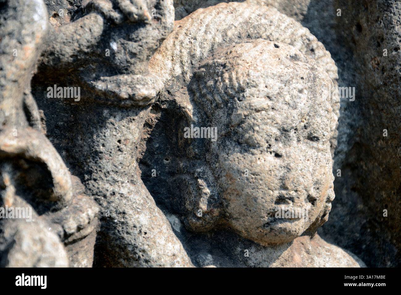 Carved stone artifacts displayed near the Solah Khamba Masjid, Fort ...