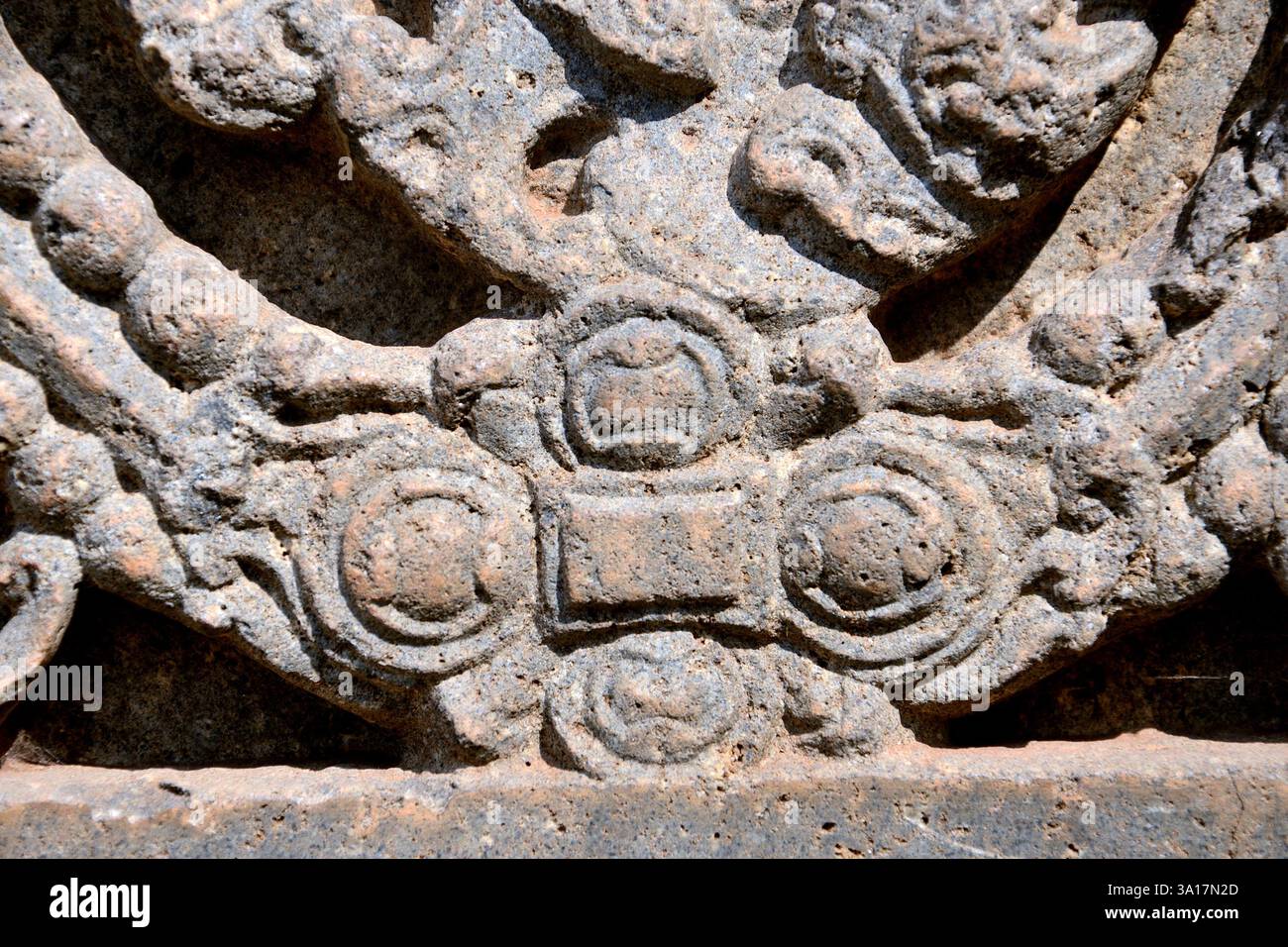 Carved stone artifacts displayed near the Solah Khamba Masjid, Fort ...