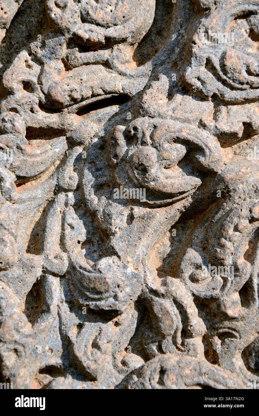 Carved stone artifacts displayed near the Solah Khamba Masjid, Fort ...