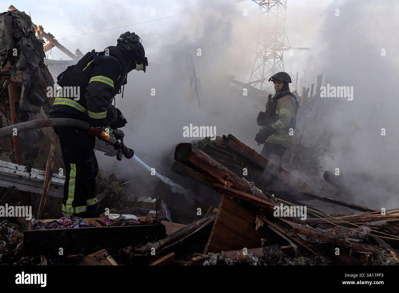 In this photo provided by the Ukrainian Emergency Service, firefighters ...