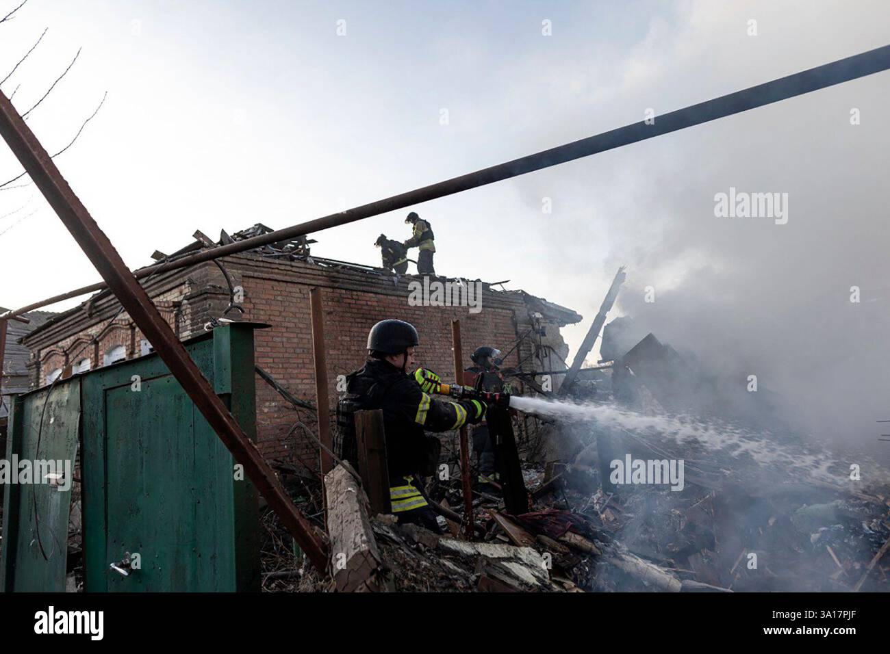 In this photo provided by the Ukrainian Emergency Service, firefighters ...