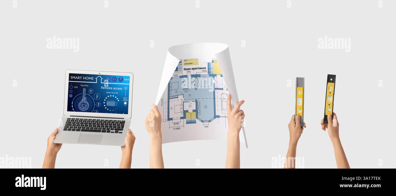 Architects with house plan, laptop and levels on light background Stock ...