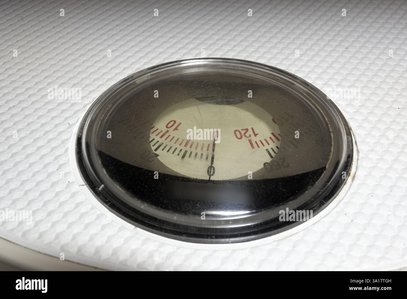 rotating measuring scale of analog bathroom scales with white ribbed ...
