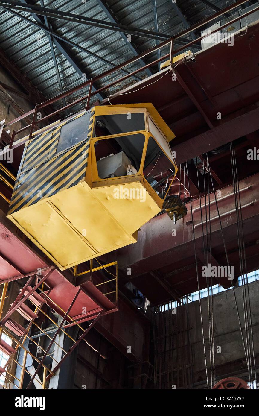 yellow Industrial crane cabin inside factory Stock Photo - Alamy