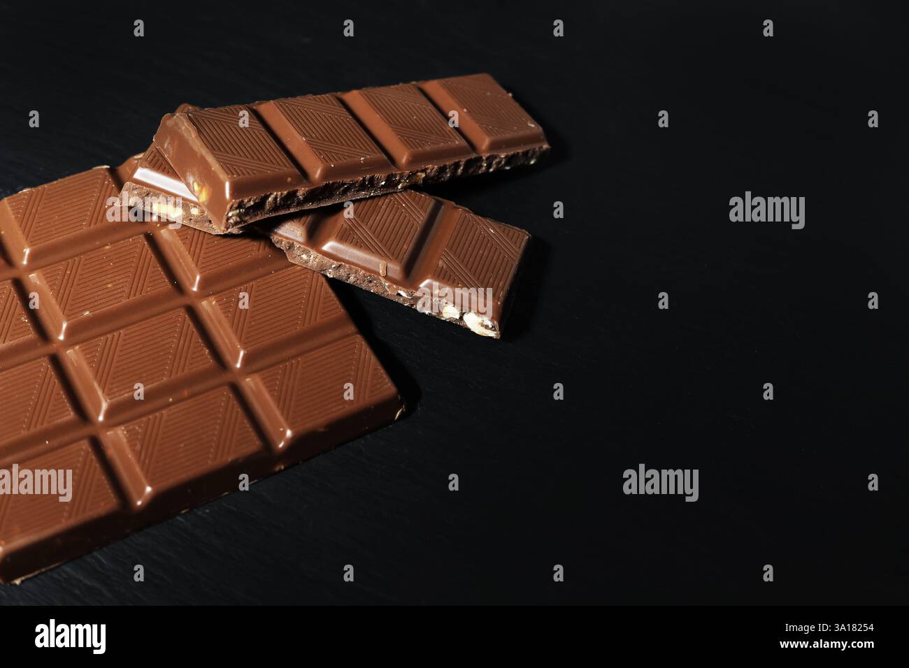 chocolate bar on black background. milk chocolate on black stone. from ...