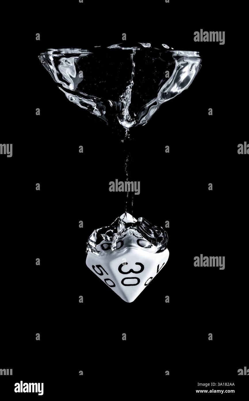 Black en white closeup photo of a D10 dice dropped in water with frozen ...