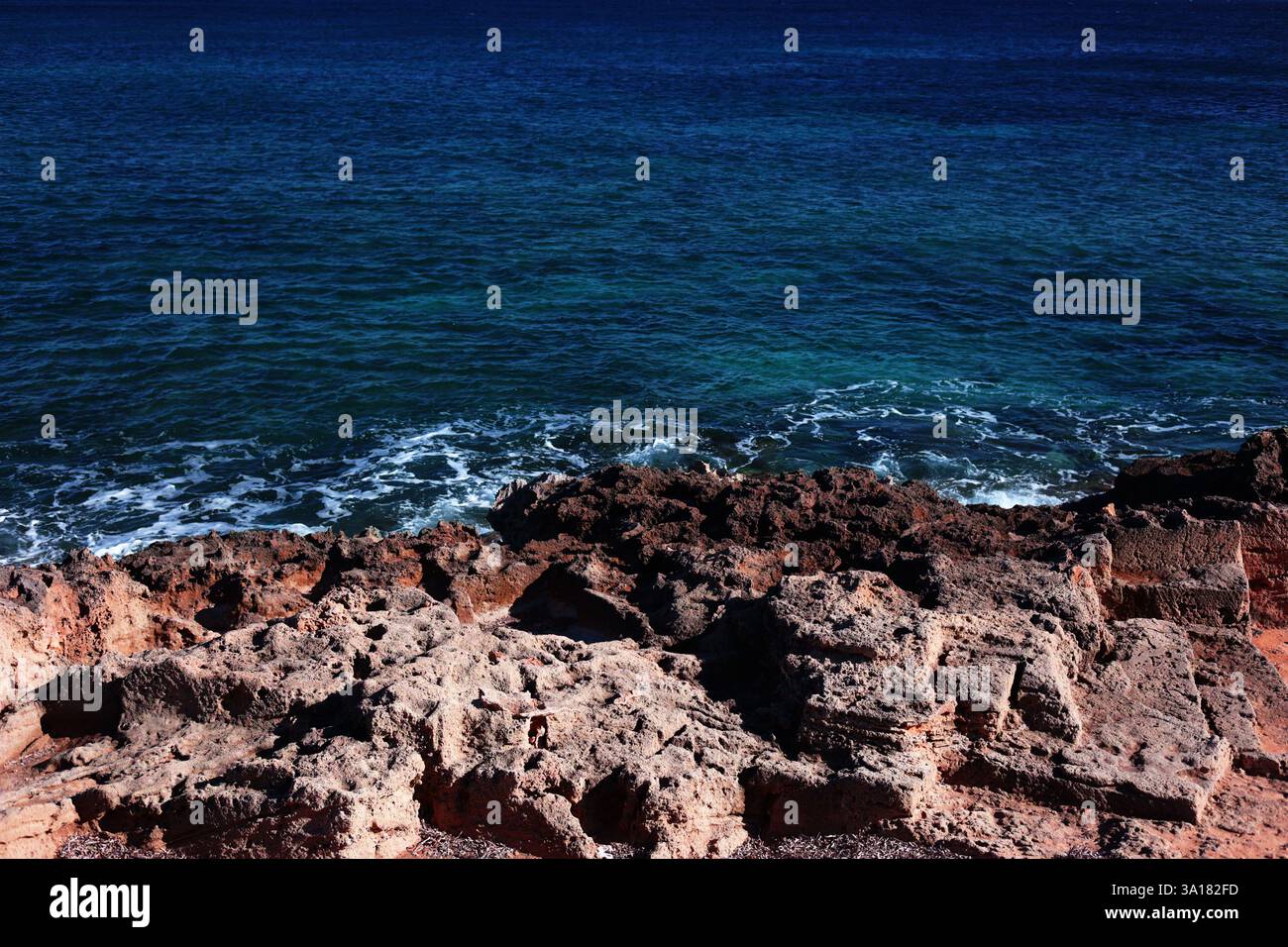 boundary of water and land. boundary of sea and shore. rocky seashore ...