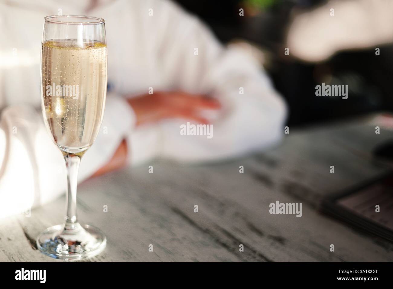 a glass of champagne on the table plays with bubbles. cocktails and drinks in a restaurant. date ...