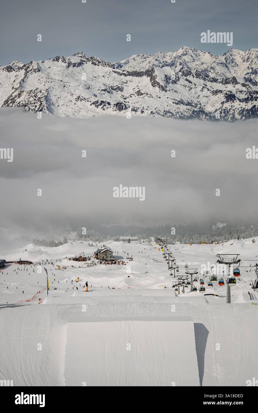 Snow covered jump ramp, kicker in a winter landscape with soft lighting ...