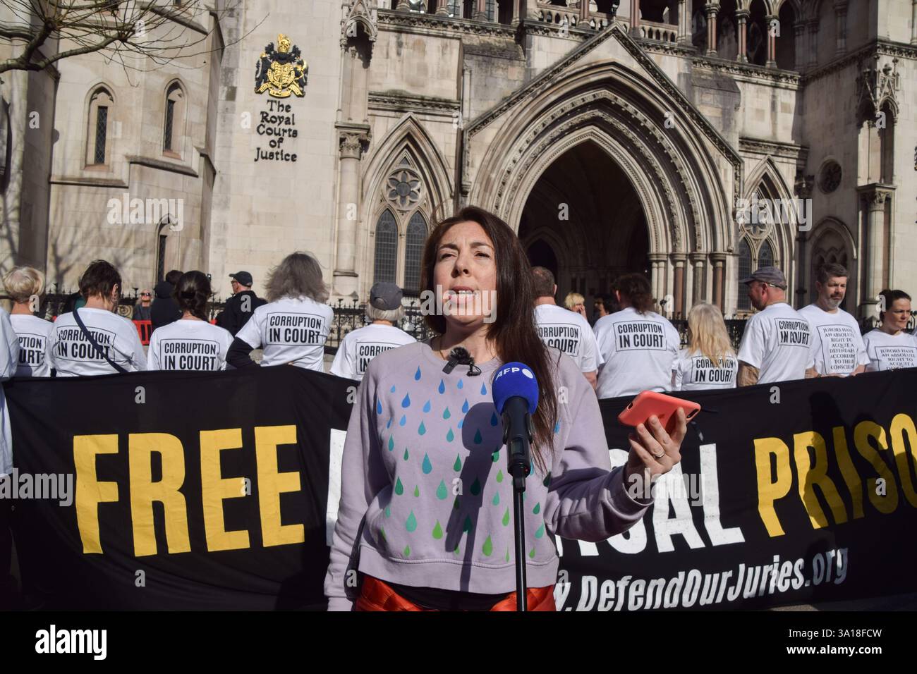 London, UK. 07th Mar, 2025. Climate activist Amy Pritchard reads a ...
