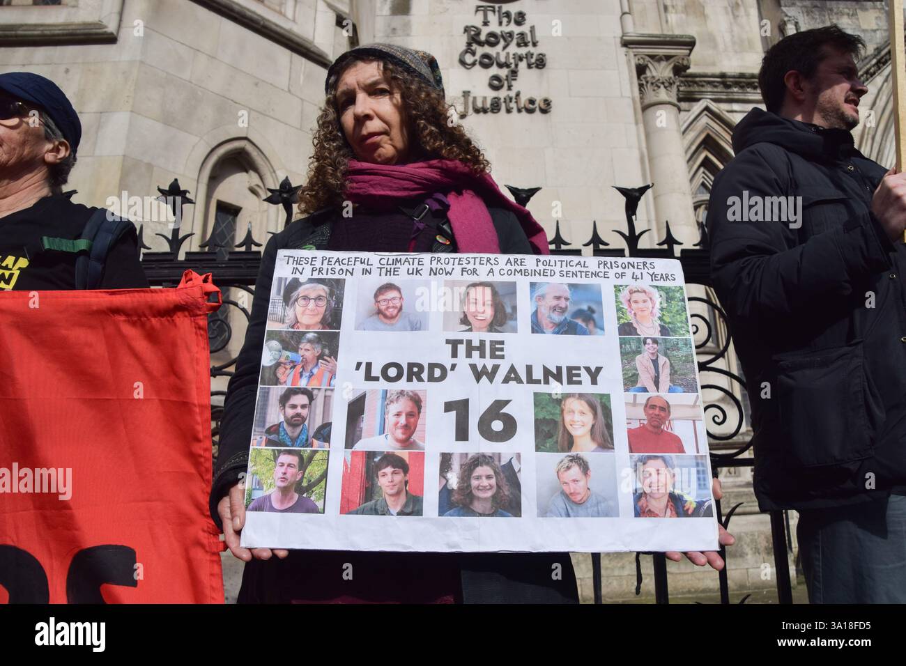 London, UK. 07th Mar, 2025. A climate activist holds a placard with ...