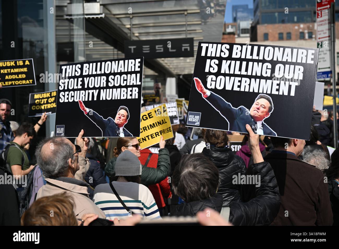 People attend the 'Tesla Takedown NYC - Pull the Plug on Elon' protest ...