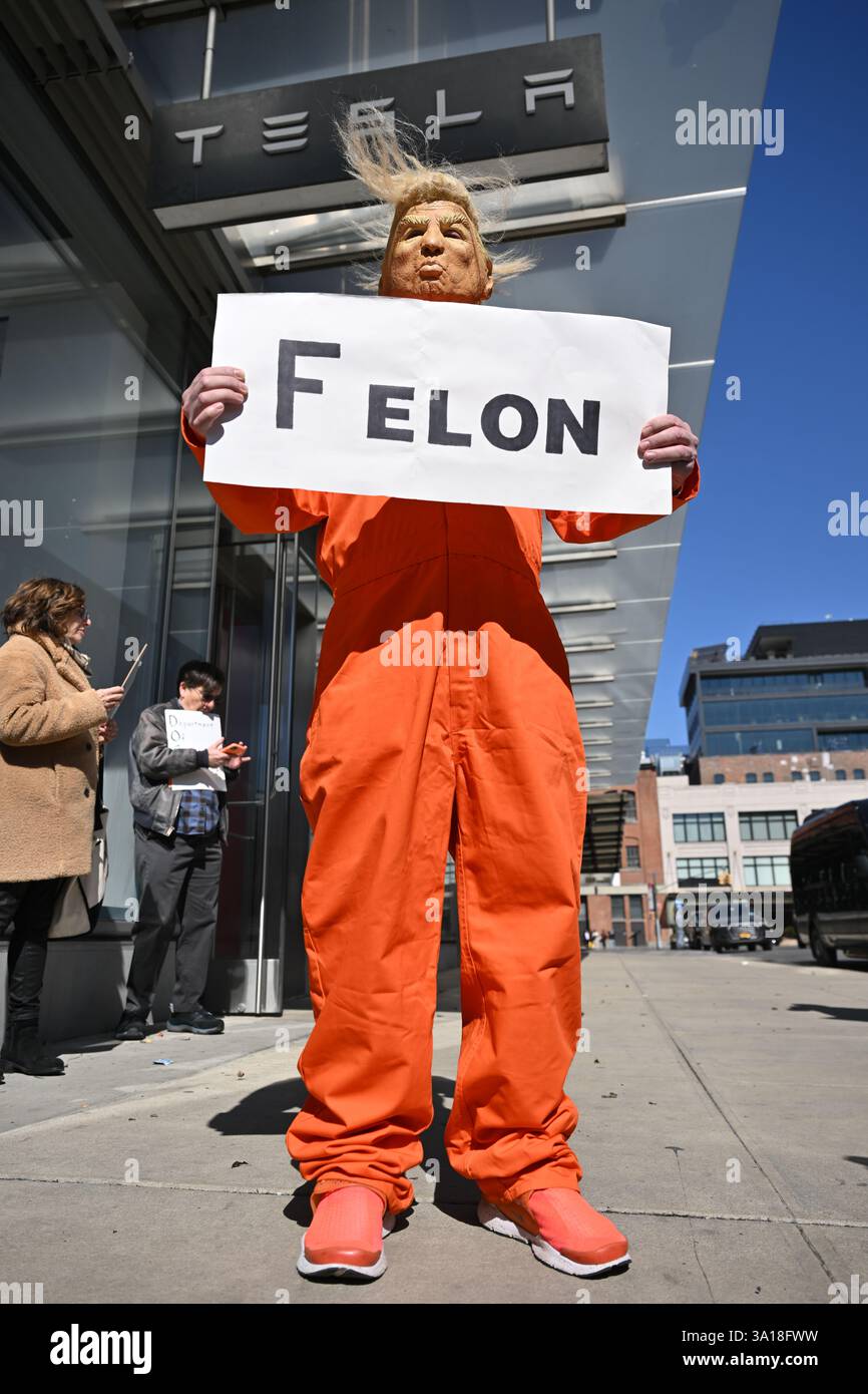 People attend the 'Tesla Takedown NYC - Pull the Plug on Elon' protest ...