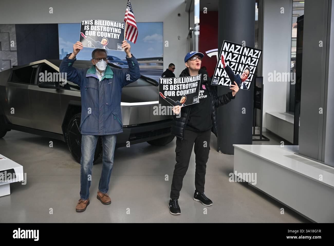 People attend the 'Tesla Takedown NYC - Pull the Plug on Elon' protest ...