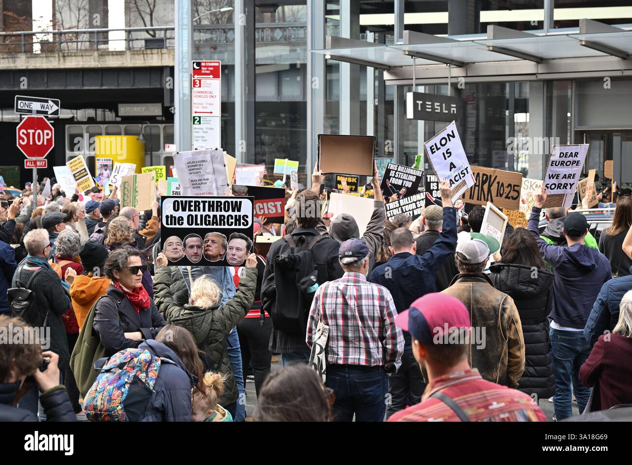 People attend the 'Tesla Takedown NYC - Pull the Plug on Elon' protest ...