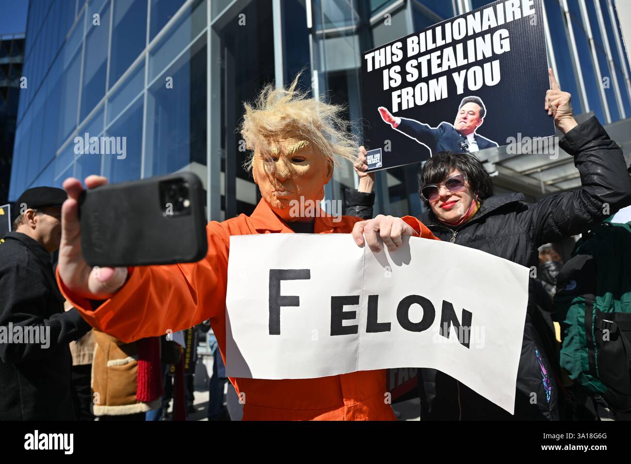 People attend the 'Tesla Takedown NYC - Pull the Plug on Elon' protest ...