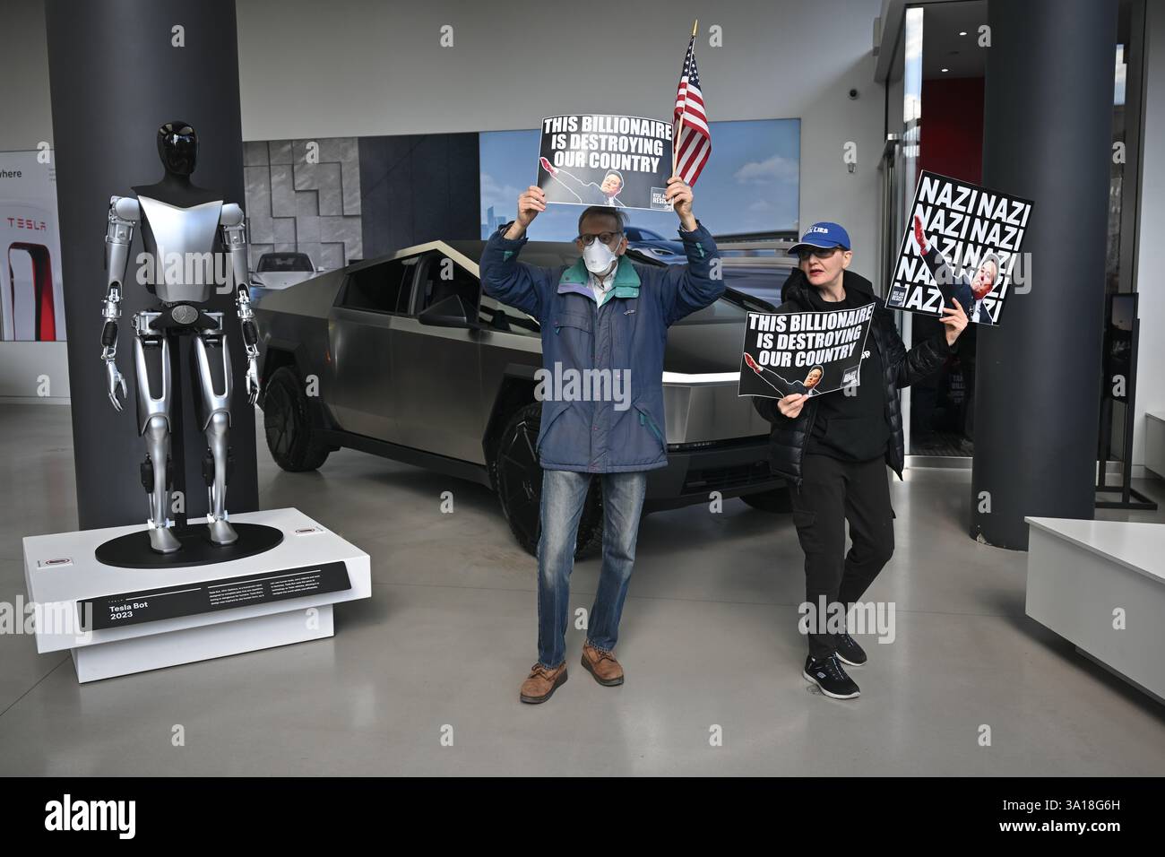 People attend the 'Tesla Takedown NYC - Pull the Plug on Elon' protest ...