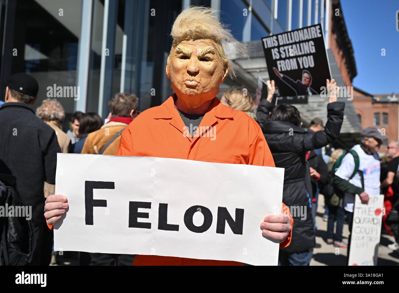 People attend the 'Tesla Takedown NYC - Pull the Plug on Elon' protest ...