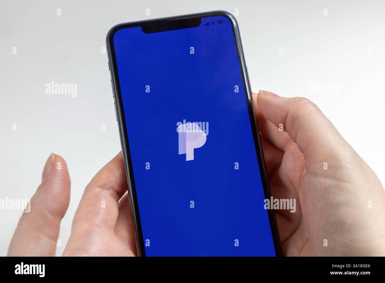 Mobile phone in hands with PayPal sign. Copenhagen, Denmark - March 3 ...