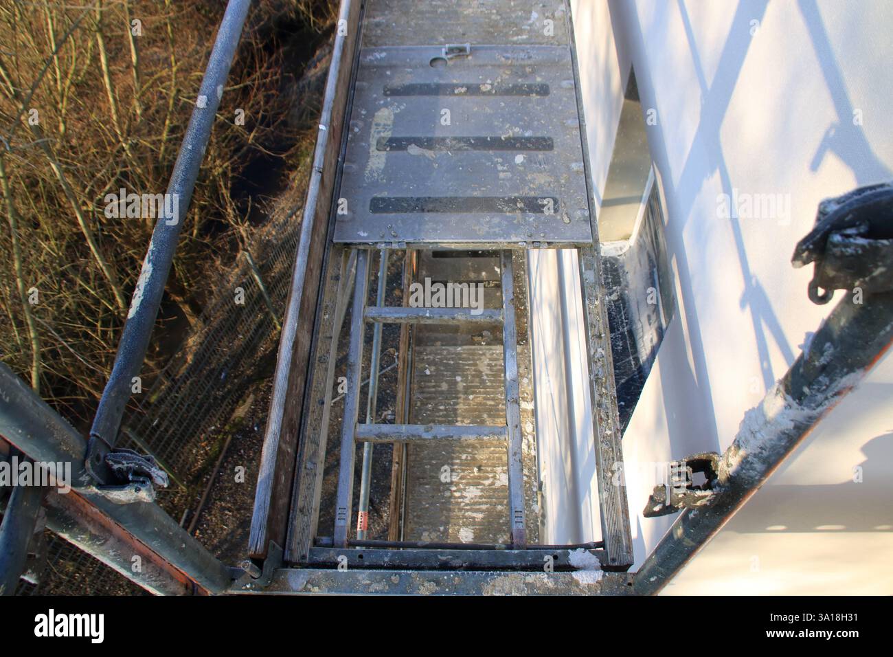 Open lid on a ladder on a scaffold Stock Photo - Alamy