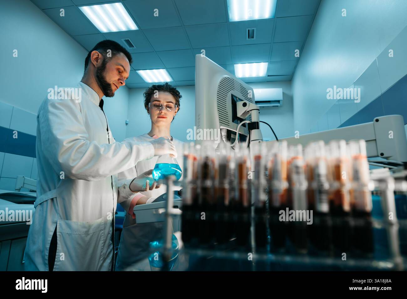 A scientist works with high-tech equipment in a modern laboratory ...
