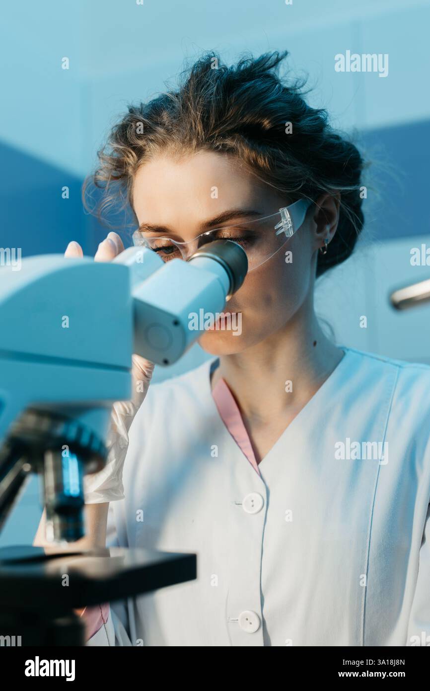 Female scientist conducts research using hi-res stock photography and ...