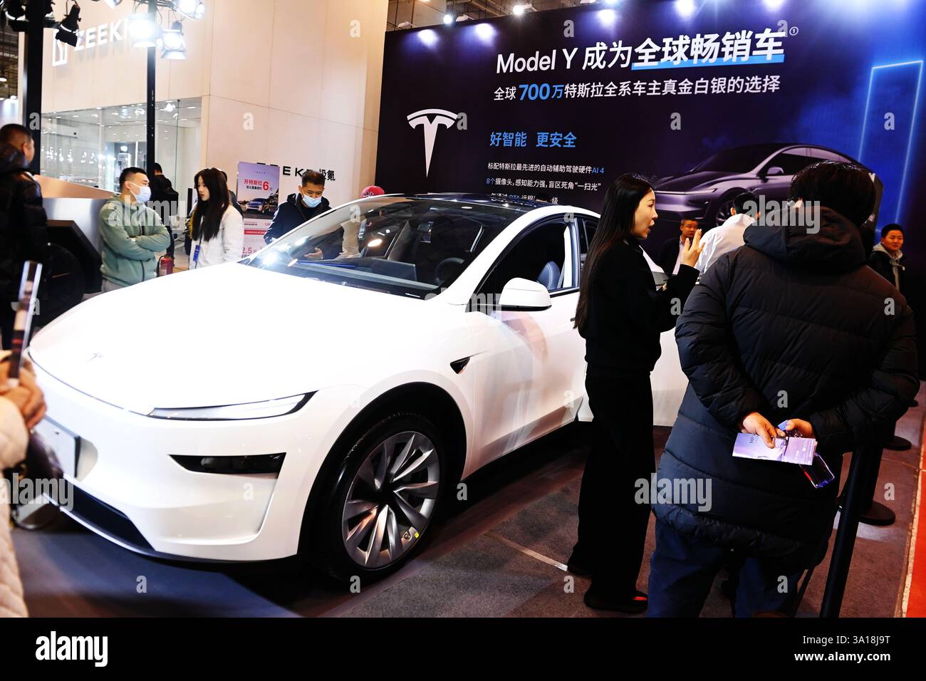 QINGDAO, CHINA - MARCH 7, 2025 - People visit Tesla booth at the 2025 ...
