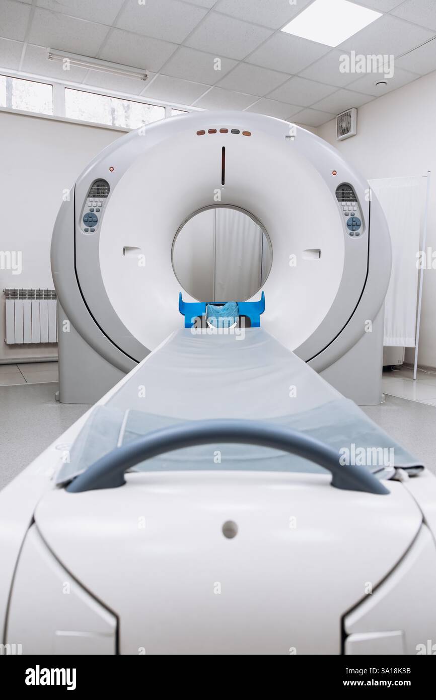 An MRI machine is positioned in a hospital, showcasing advanced imaging technology. This ...