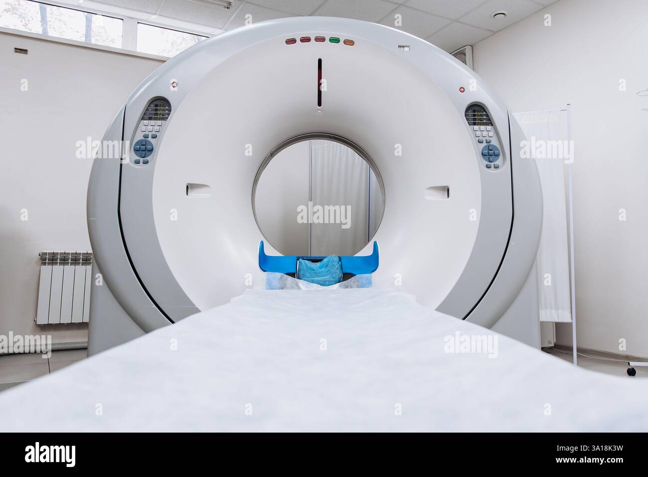 An MRI machine is positioned in a hospital, showcasing advanced imaging ...