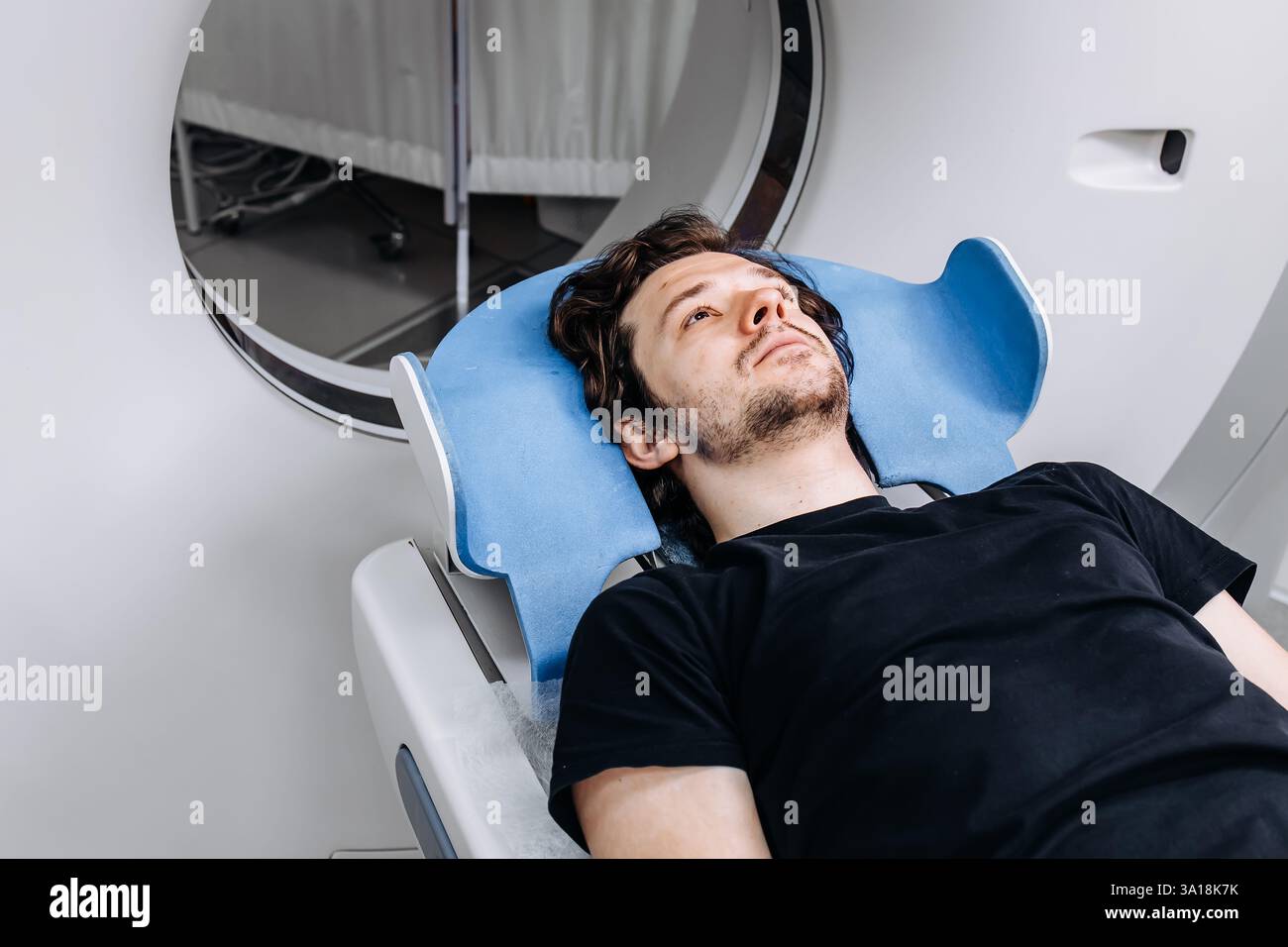 An MRI machine is positioned in a hospital, showcasing advanced imaging technology. This ...
